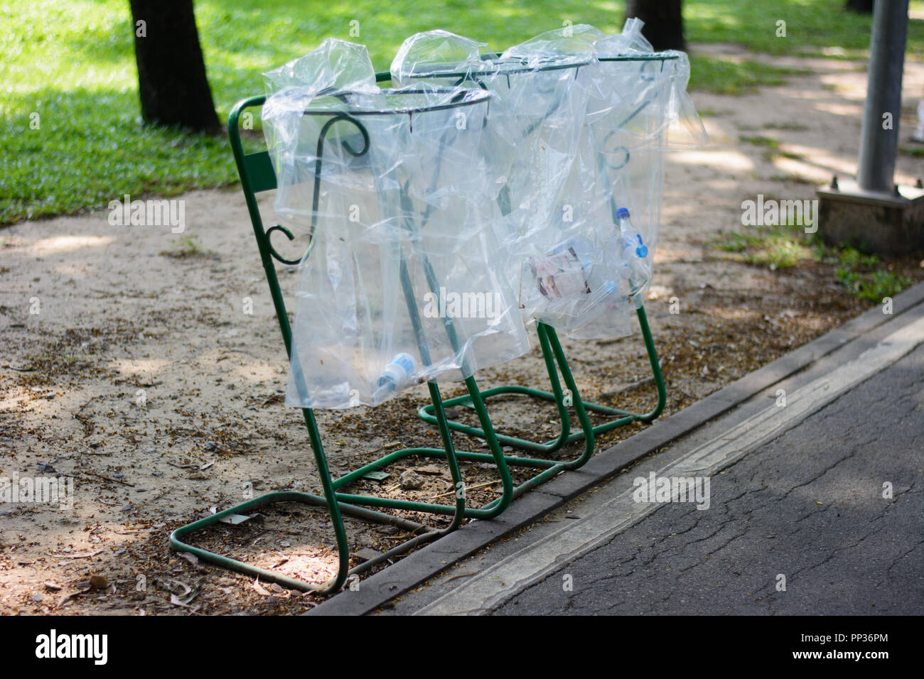 Trash in a park Stock Photo - Alamy