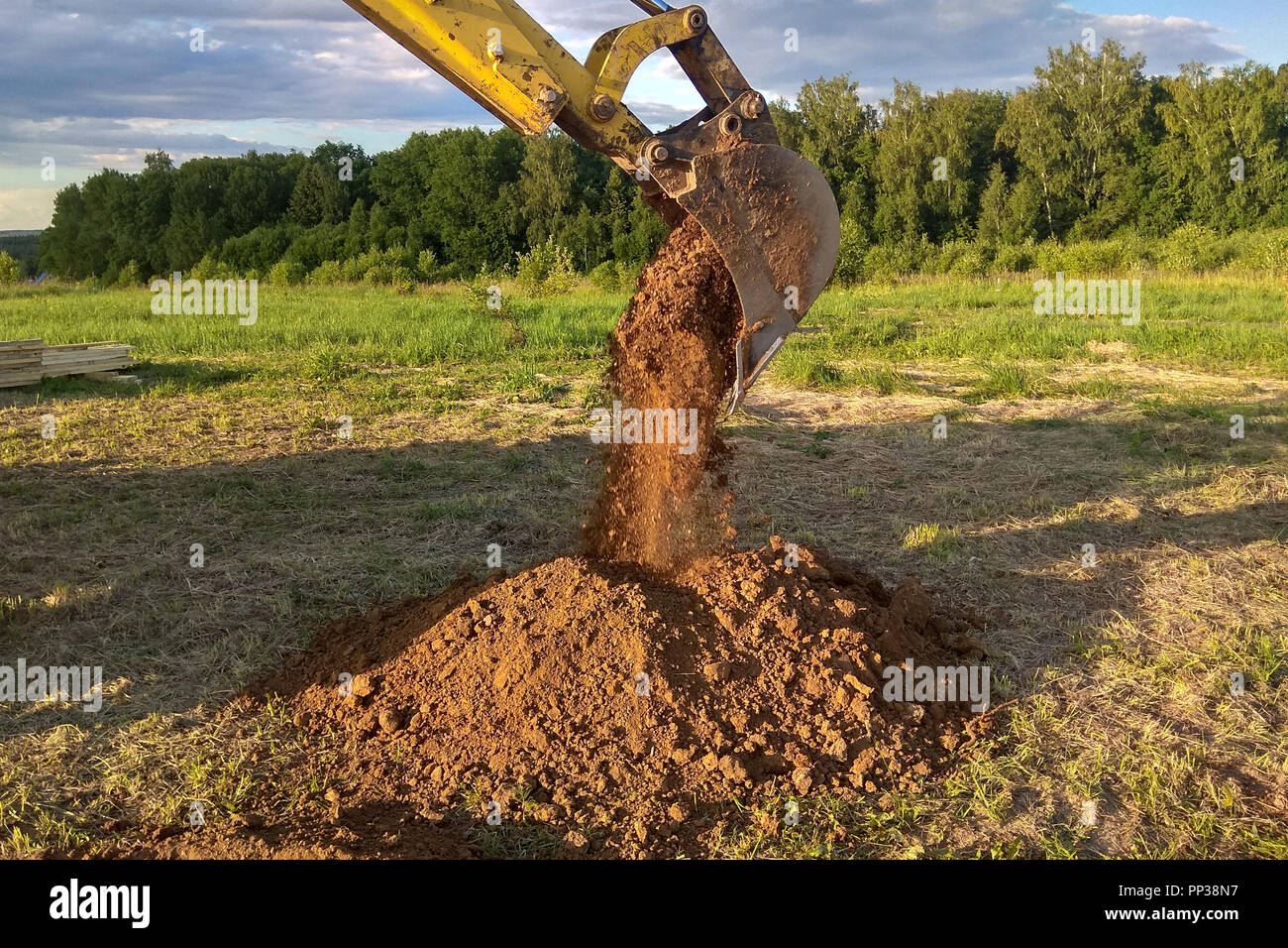 a work excavator digging a trench for the foundation of a building 2018 ...