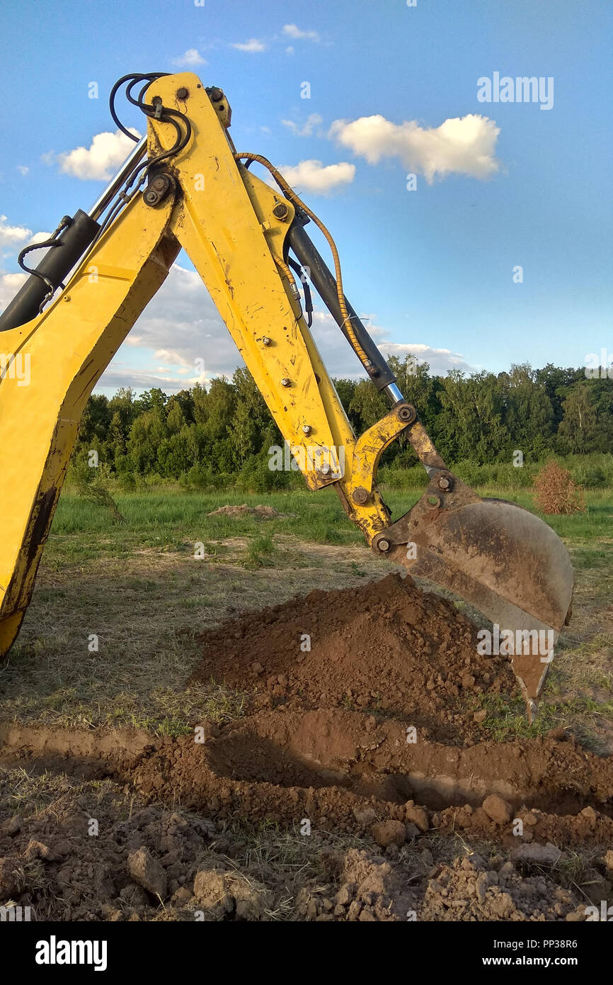 View from above at Working Excavator Tractor Digging A Trench 2018 ...