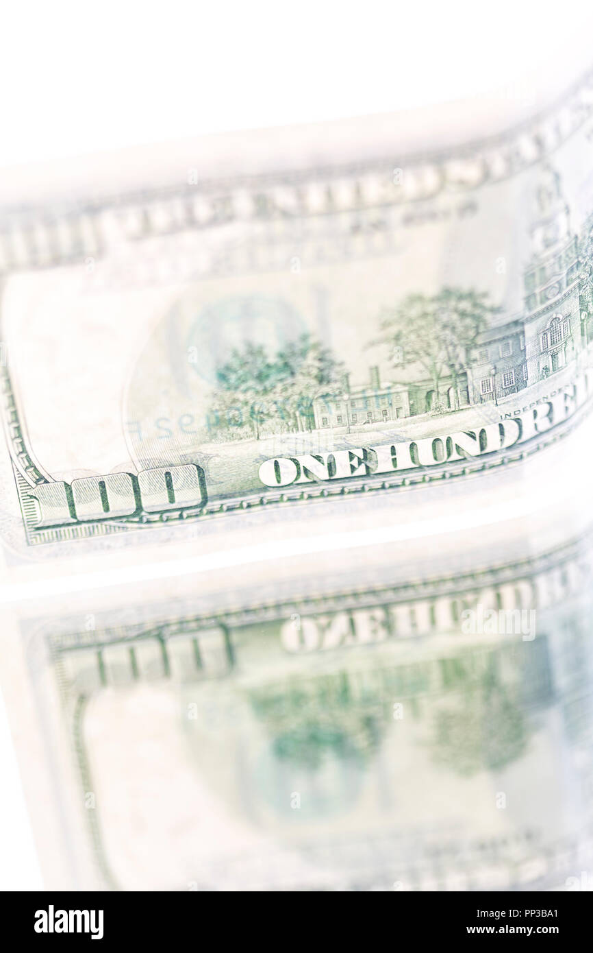 blurred dollar money background and mirror like concept of success ...