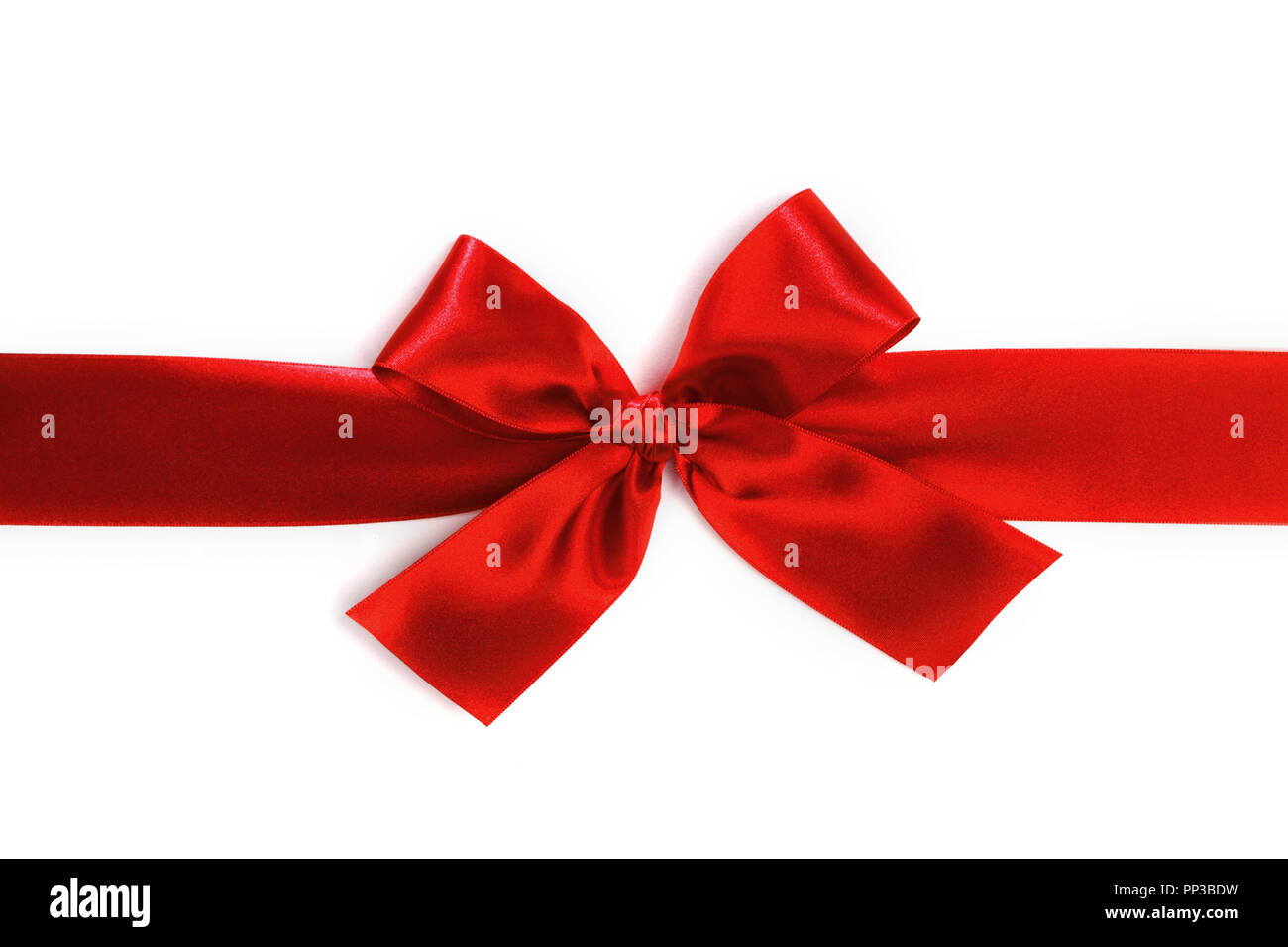Shiny red satin ribbon decorative on white background Stock Photo - Alamy
