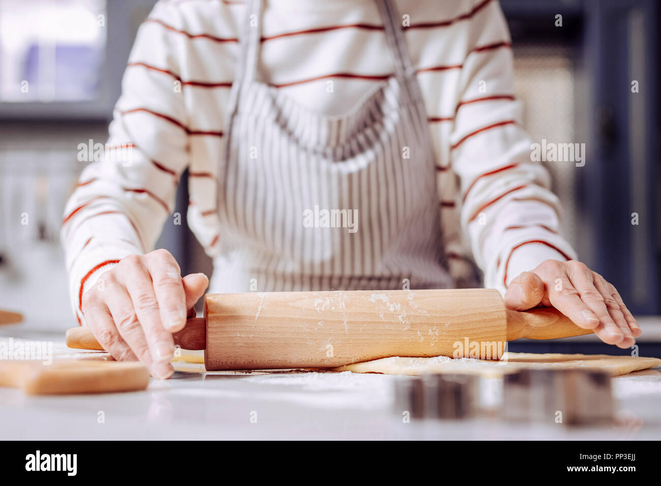 Woman holding rolling pin hi-res stock photography and images - Alamy