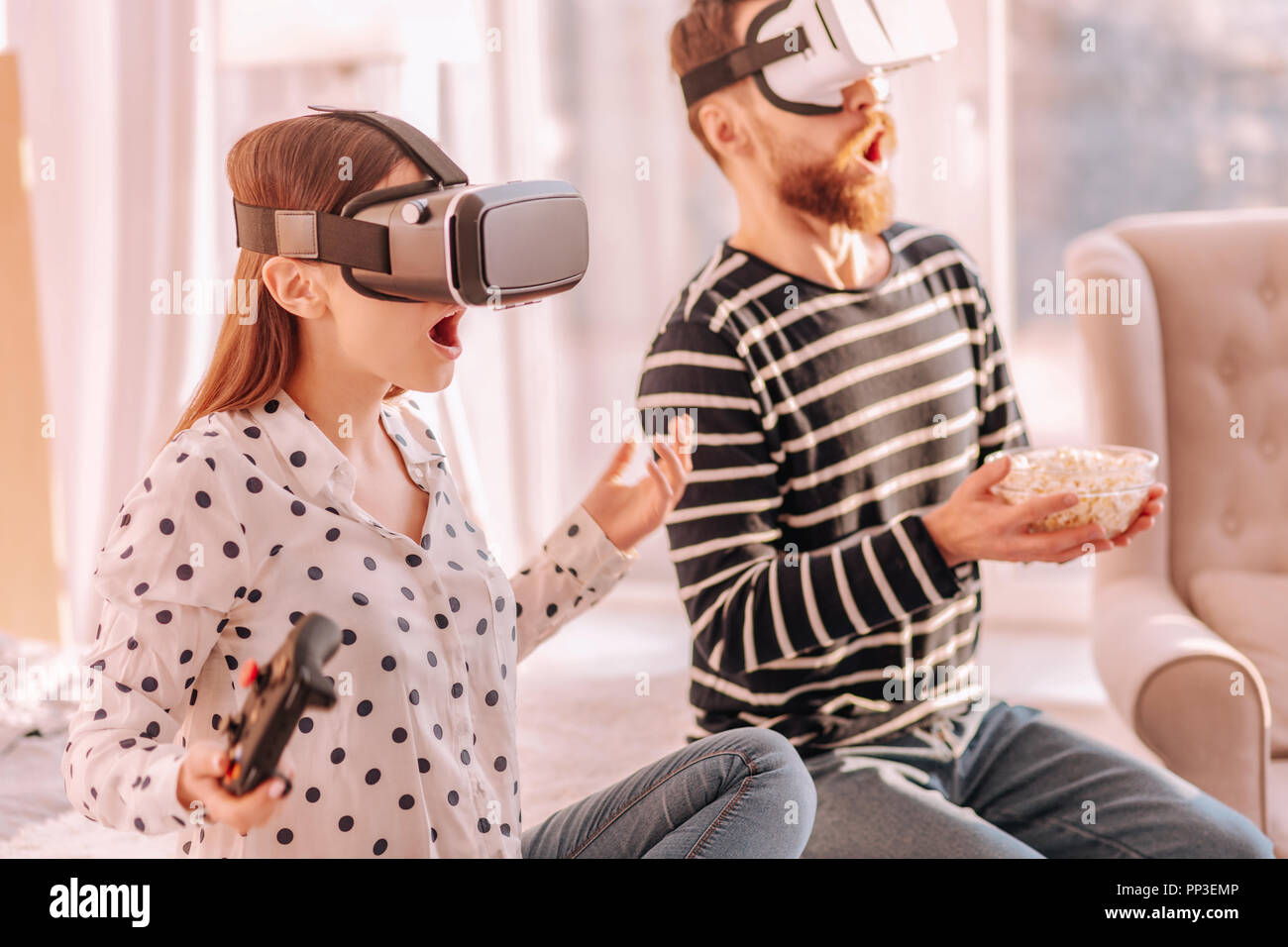 Emotional couple watching movie in virtual reality devic Stock Photo ...