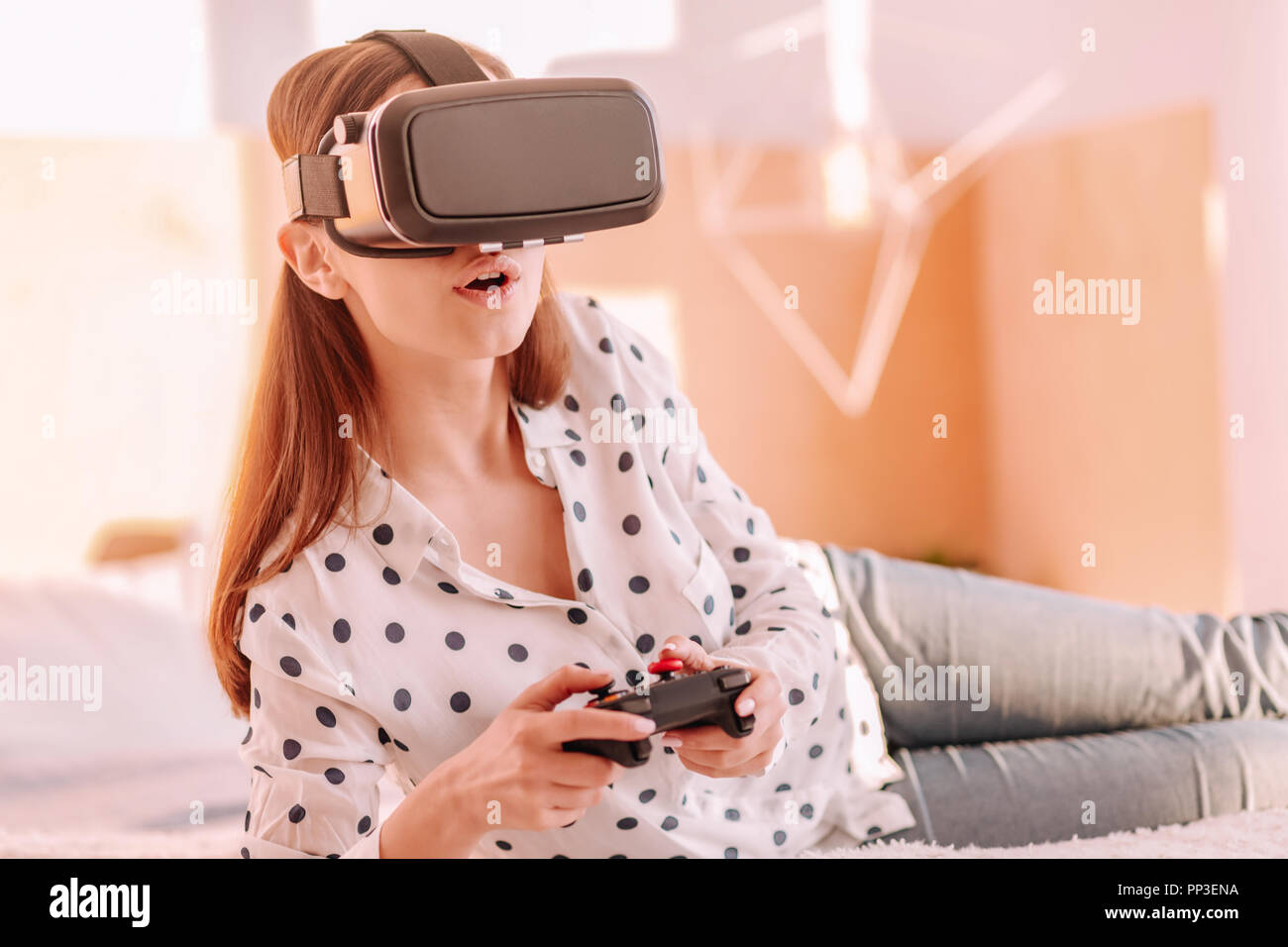 Pretty woman holding gamepad hi-res stock photography and images - Alamy