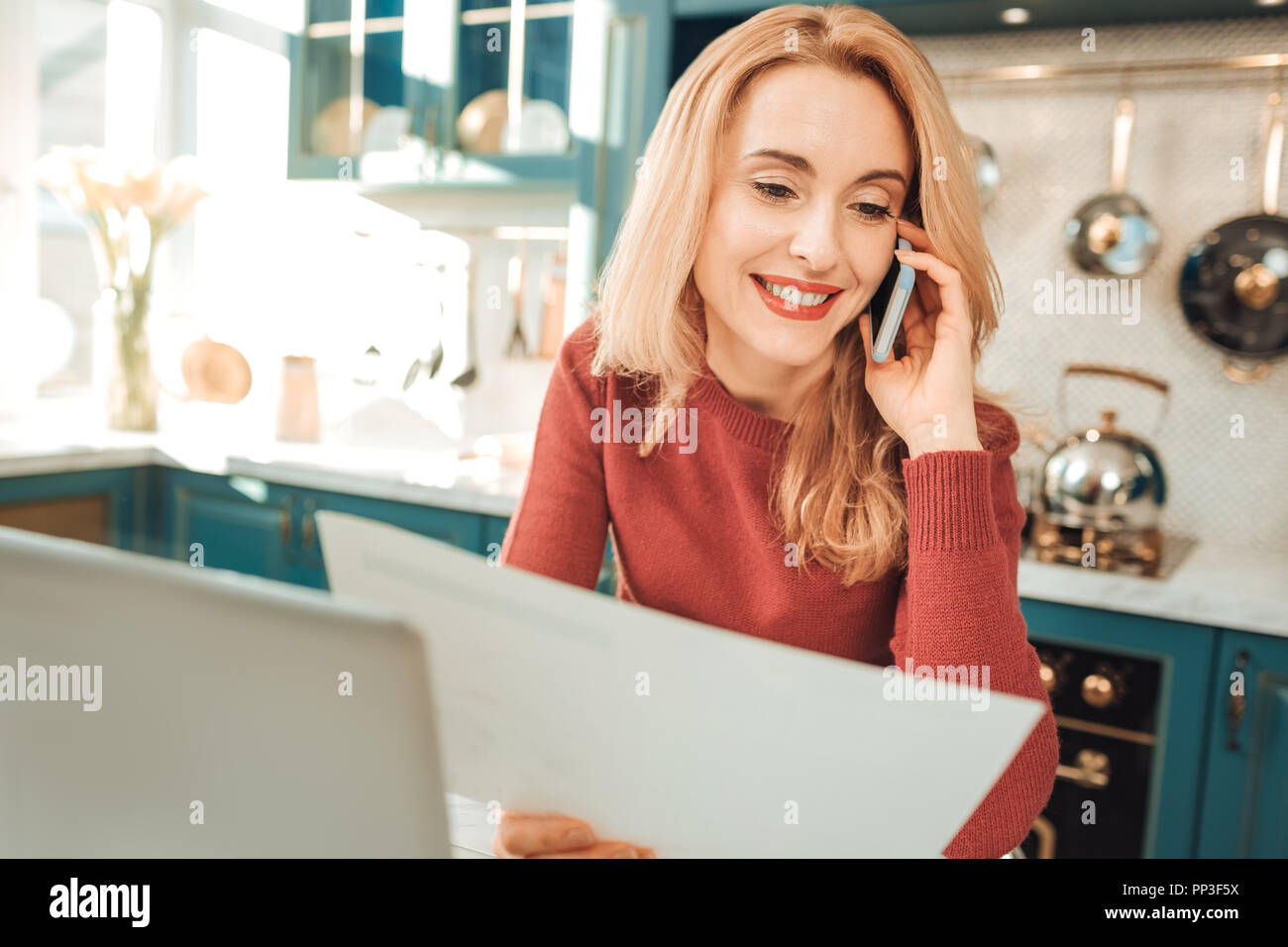 Pretty female person working at project with pleasure Stock Photo - Alamy