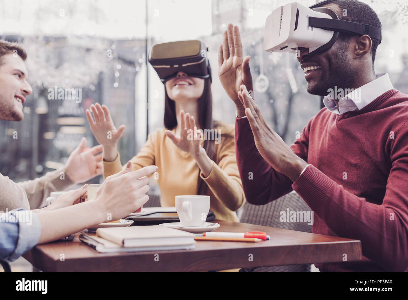 Happy friends having playful mood Stock Photo - Alamy