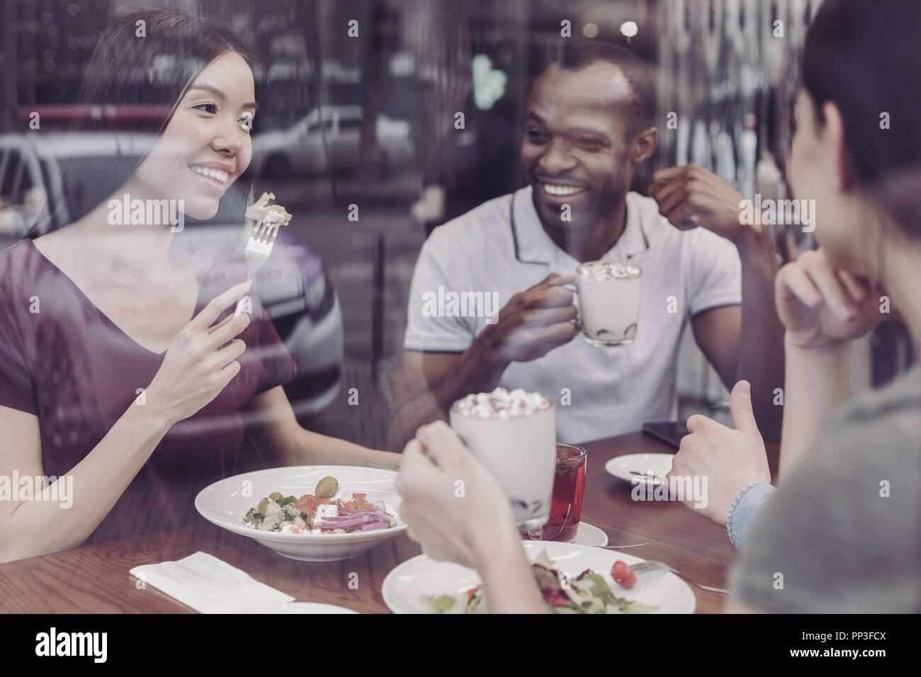 Positive delighted people having dinner Stock Photo - Alamy