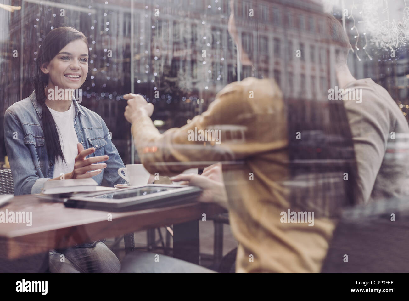 Pleased girls talking about their project Stock Photo - Alamy