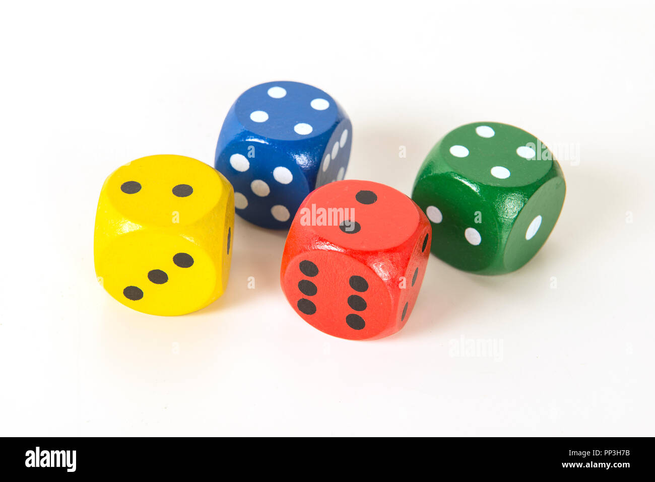 Four colorful gaming dices on a white background background in random ...