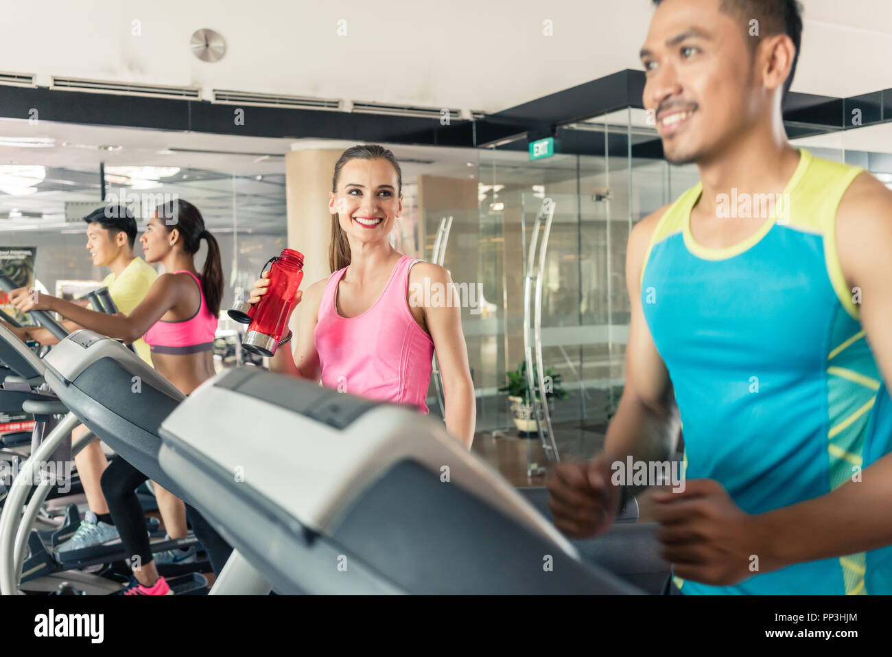 Fit active woman running on treadmill during workout Stock Photo - Alamy
