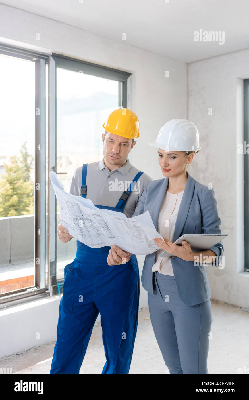 Project owner and construction worker during acceptance Stock Photo - Alamy