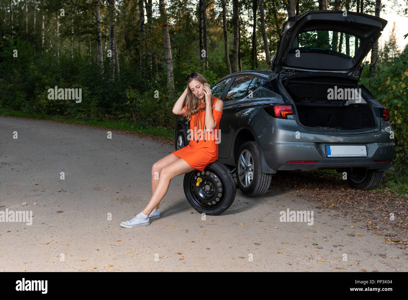 Woman driver making call, asking help for car service Stock Photo - Alamy