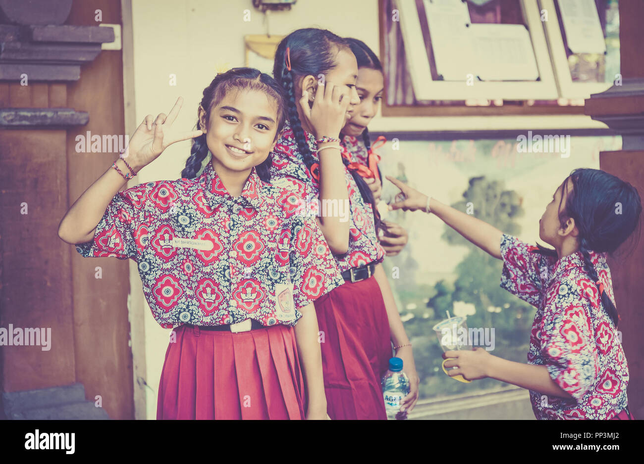 BALI, INDONESIA - APRIL 25, 2018: Young happy pupils wearing balinese ...