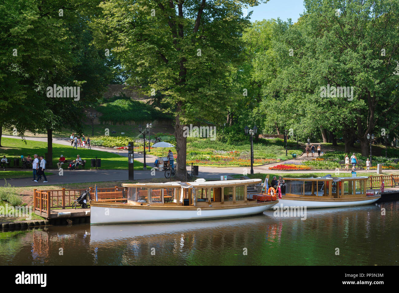 Riga park, view on a summer afternoon of pleasure boats moored in ...