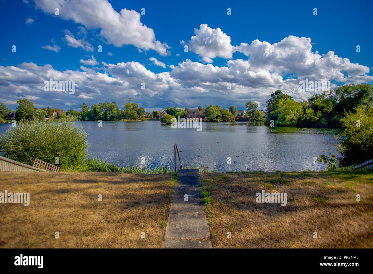 garden looking over lake with wildlife Stock Photo - Alamy