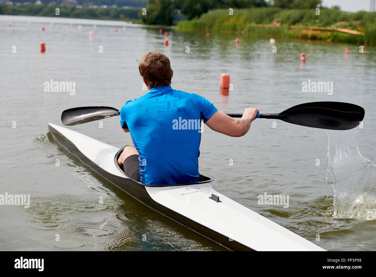 Rower floating in a canoe Stock Photo - Alamy