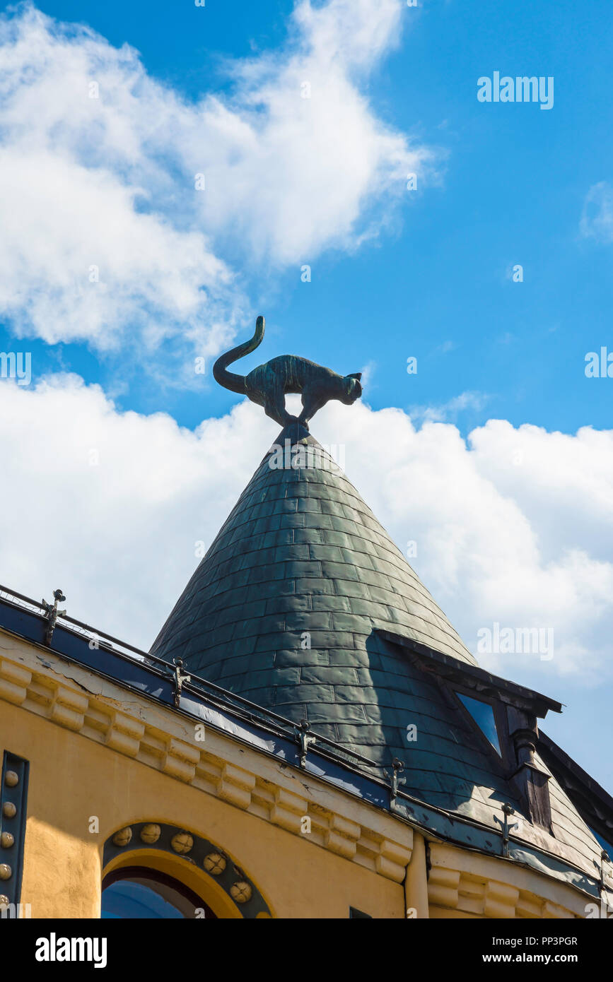 Riga Cat House, view of a cat in silhouette mounted on a corner turret ...
