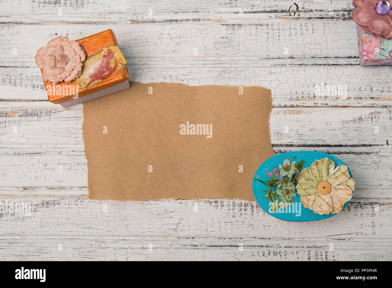 Brown kraft paper with decorated gift boxes laying near it Stock Photo ...