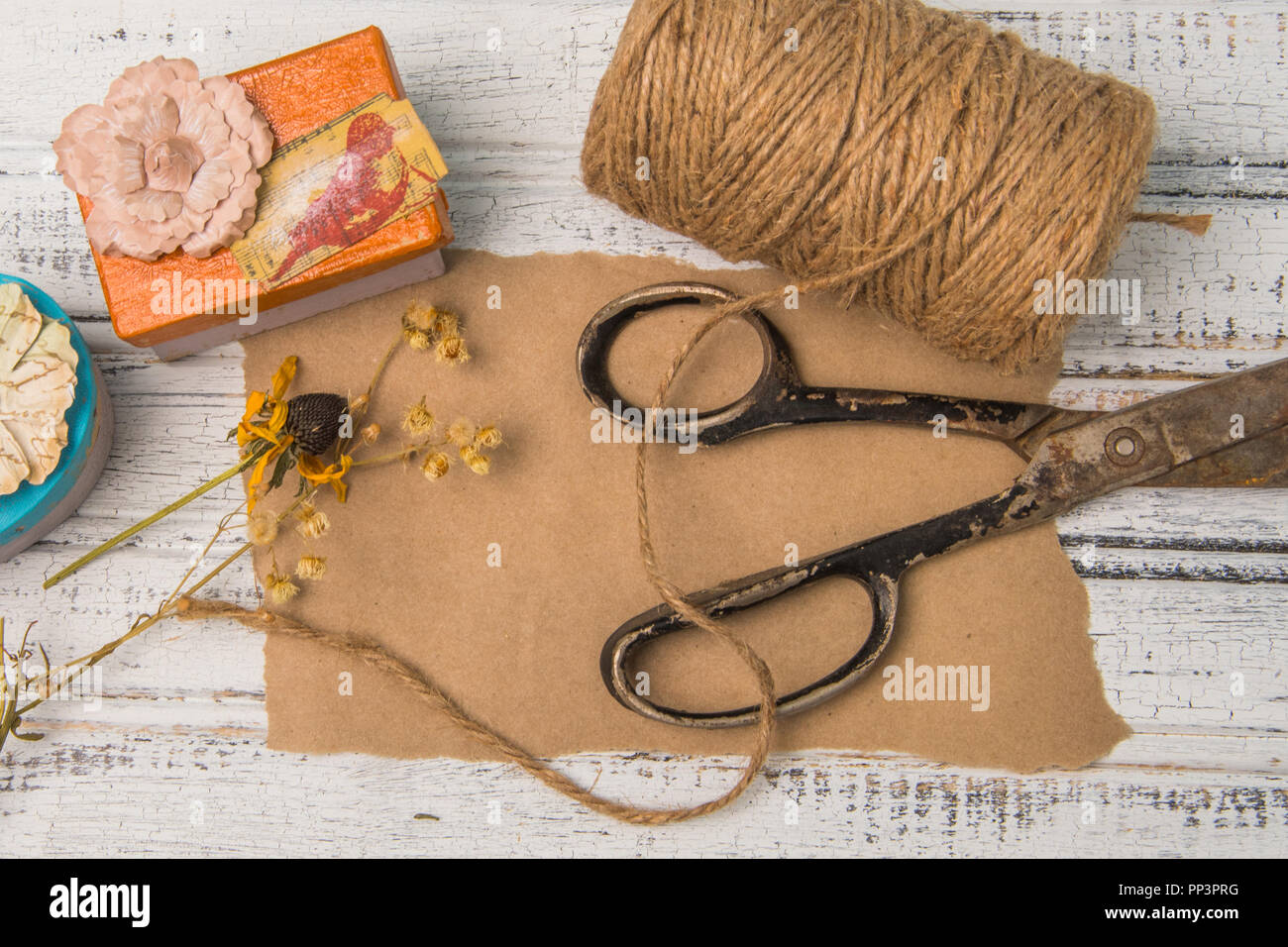 Background of old scissors, paper, boxes and jute Stock Photo - Alamy