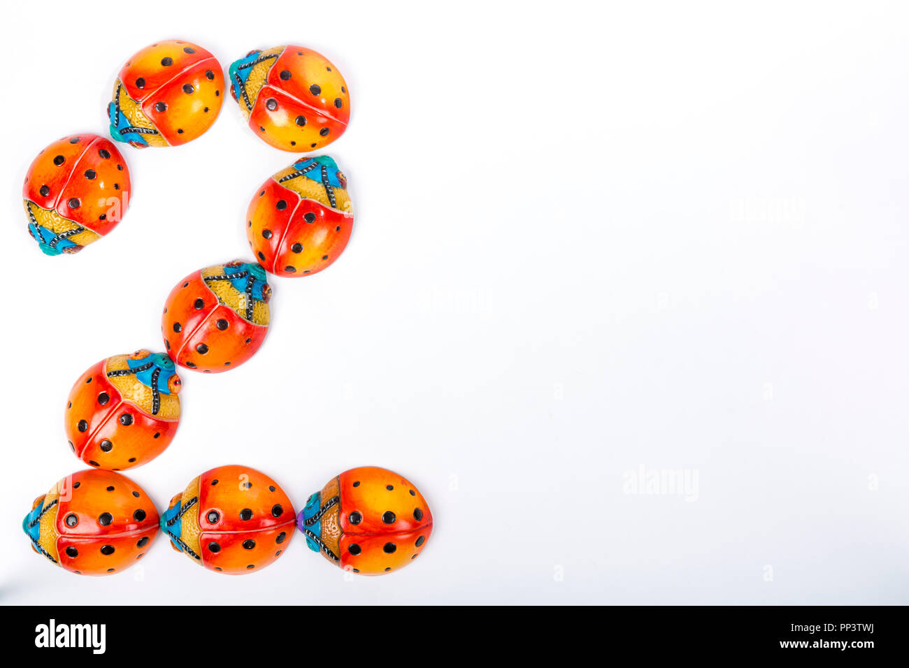 set of multicolored ladybugs forming an number 2 in Mexican ceramics ...