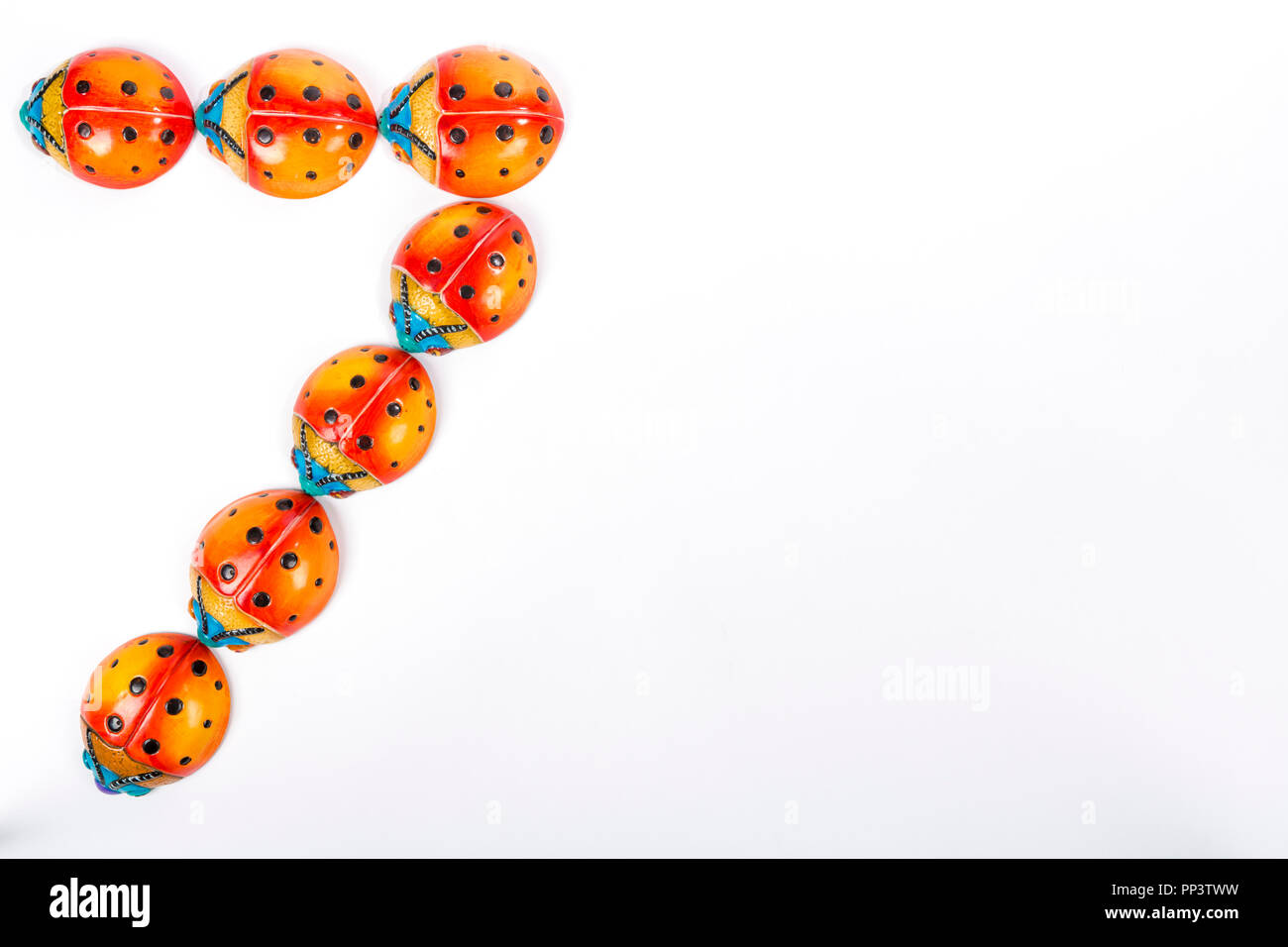 set of multicolored ladybugs forming an number 7 in Mexican ceramics ...
