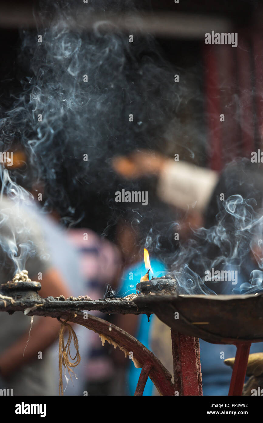 Hindu people offering prayers to god according to hindu rituals in the ...