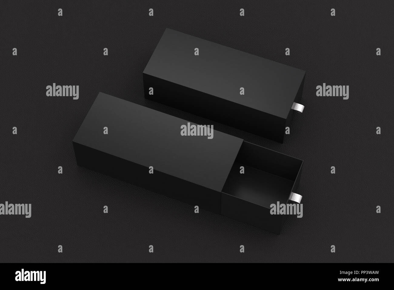 Open and closed black blank empty long boxes on black leather ...