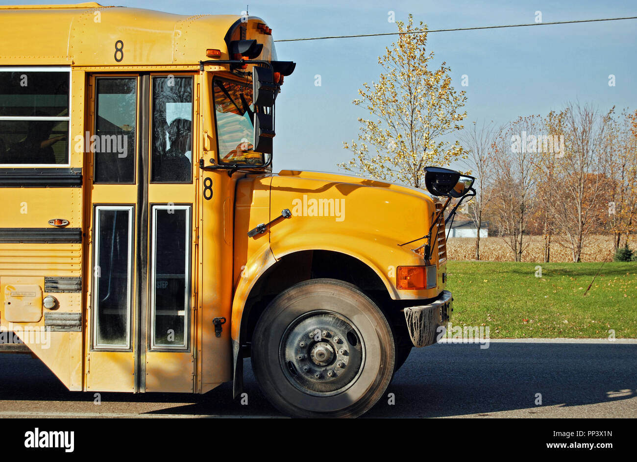yellow school bus on rural road Stock Photo - Alamy