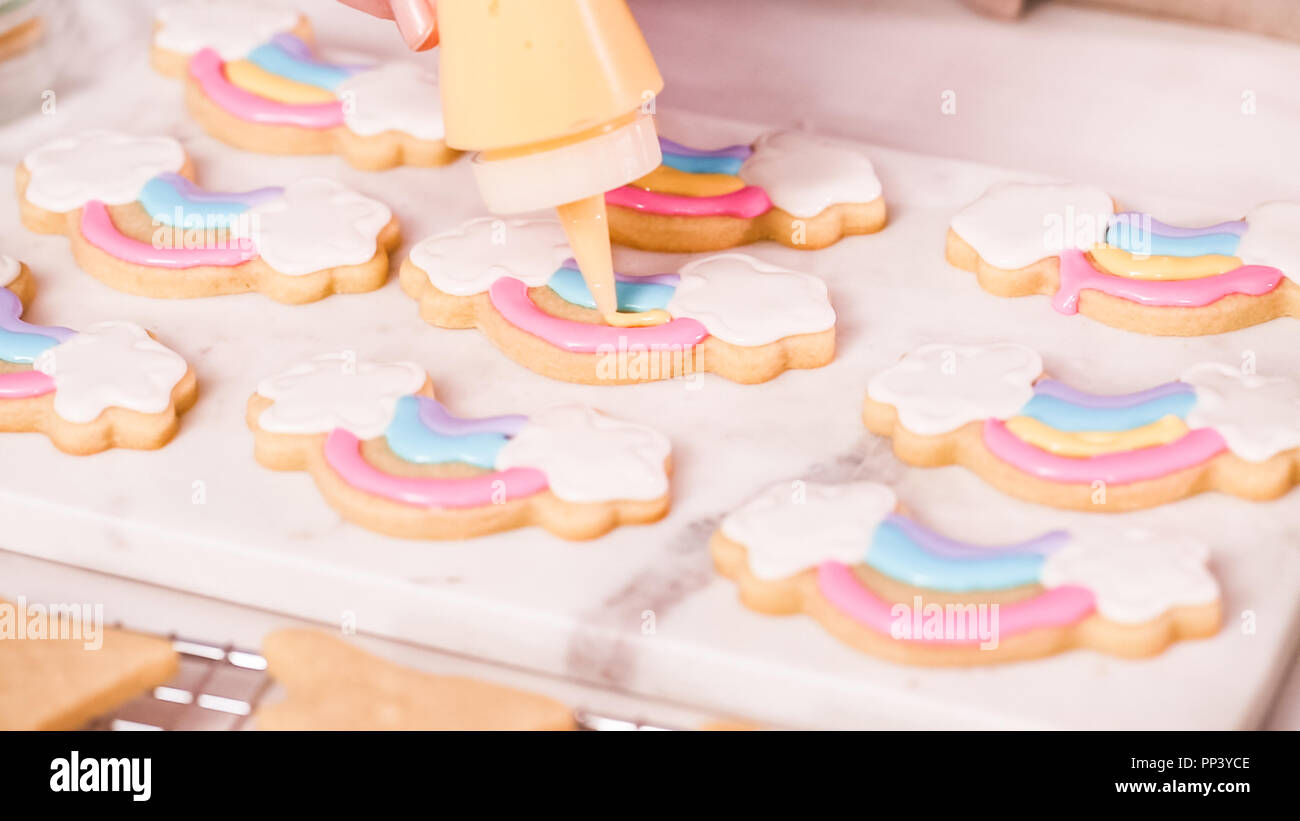 Decorating unocrn shaped sugar cookies with royal icing for little girl ...