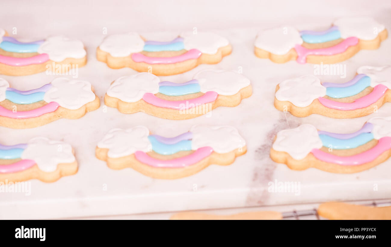 Decorating unocrn shaped sugar cookies with royal icing for little girl ...