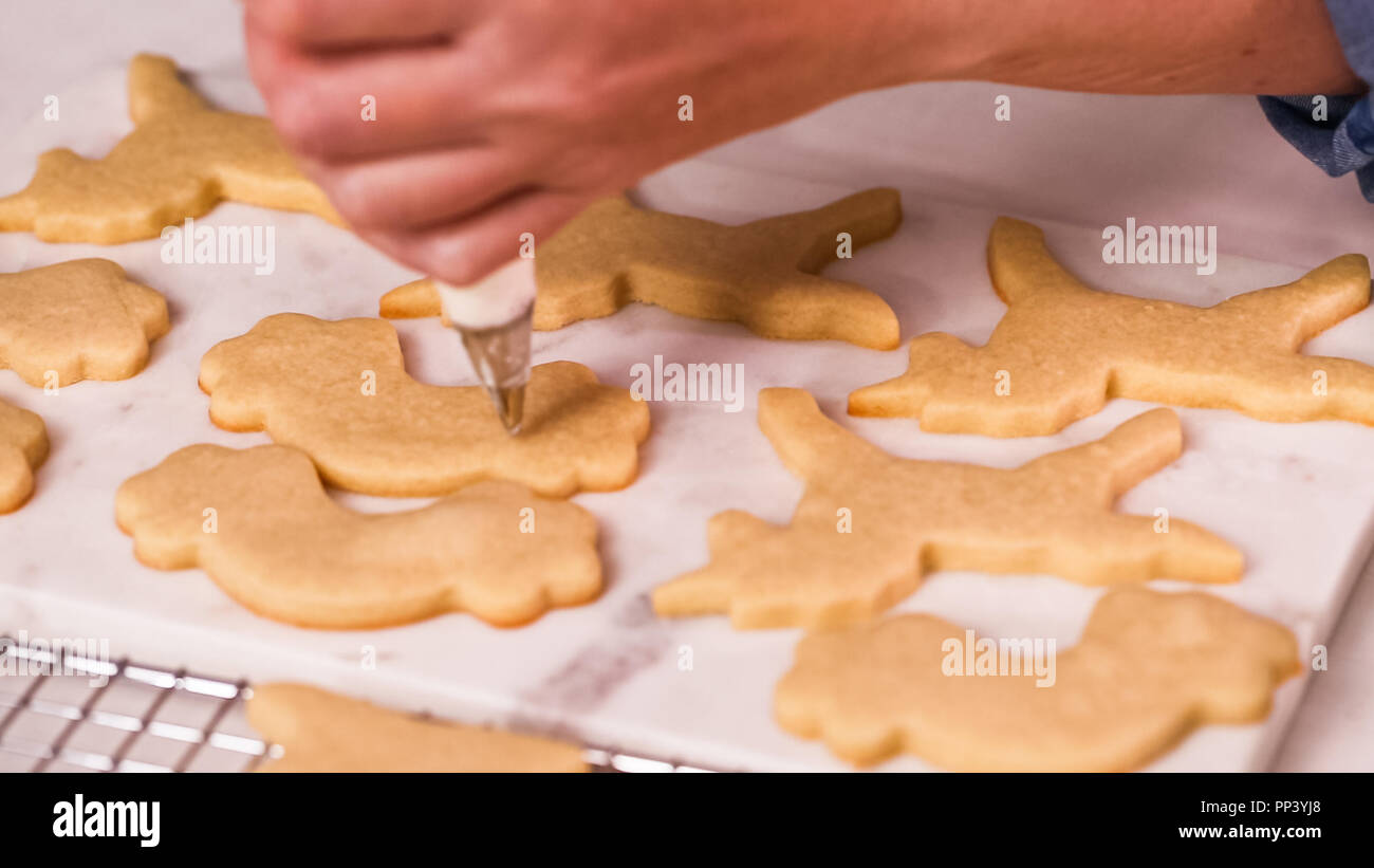 Decorating unocrn shaped sugar cookies with royal icing for little girl ...