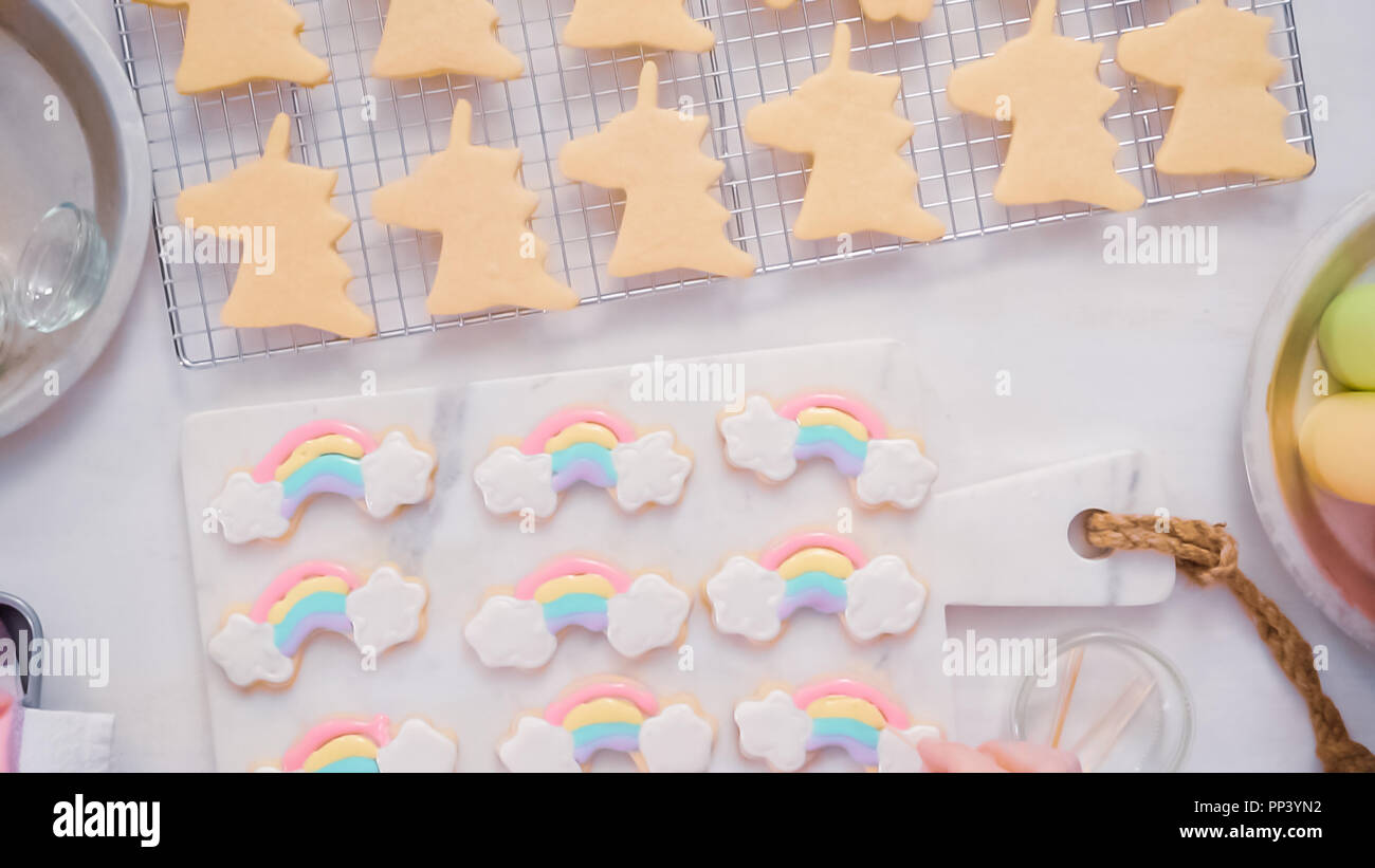 Decorating unocrn shaped sugar cookies with royal icing for little girl ...