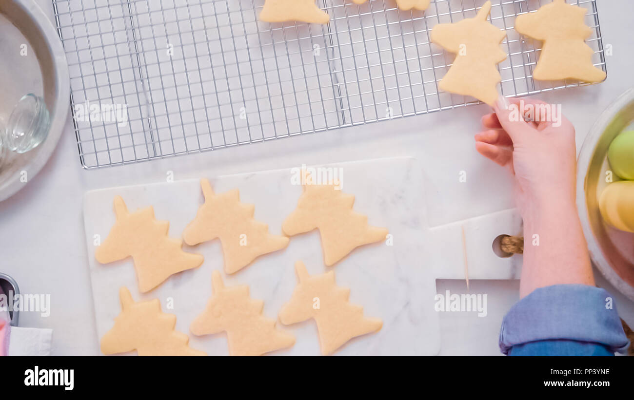 Decorating unocrn shaped sugar cookies with royal icing for little girl ...