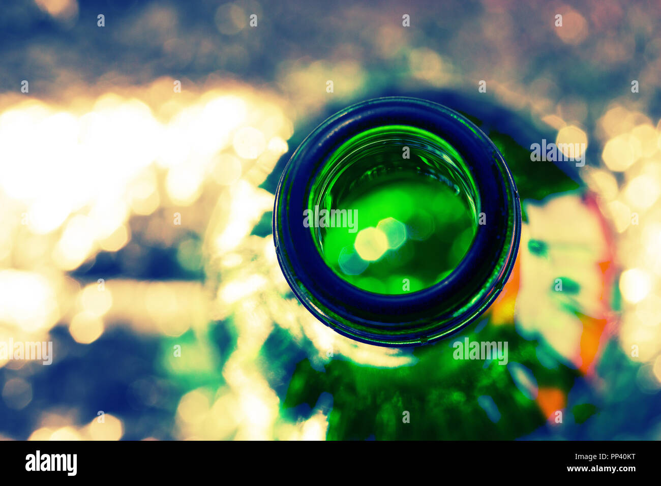 green bottle with alcohol on light background Stock Photo - Alamy