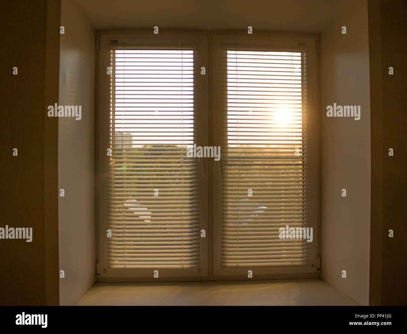 sun rise behind the window blinds and curtains shades for background ...