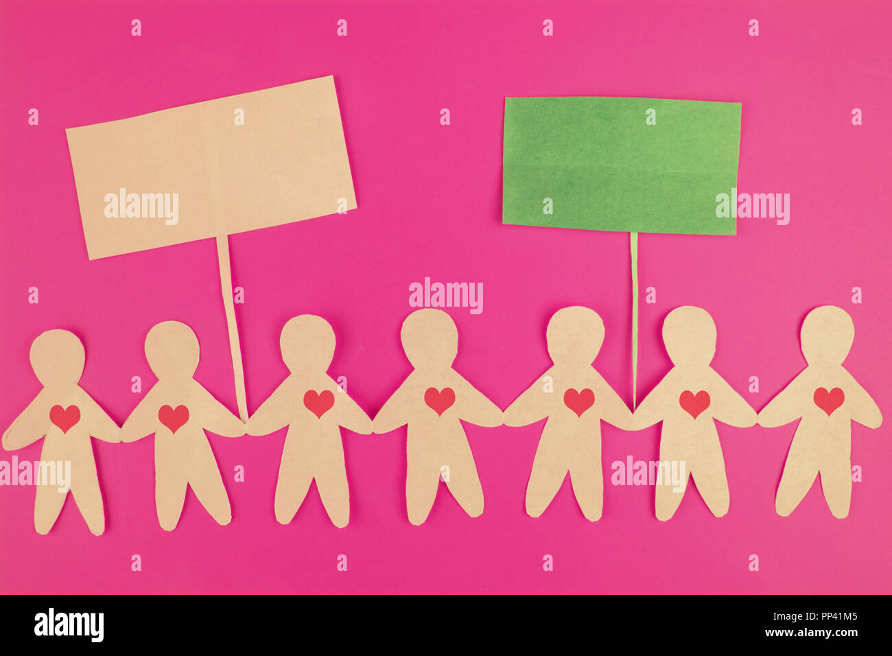 paper people on pink background Stock Photo - Alamy