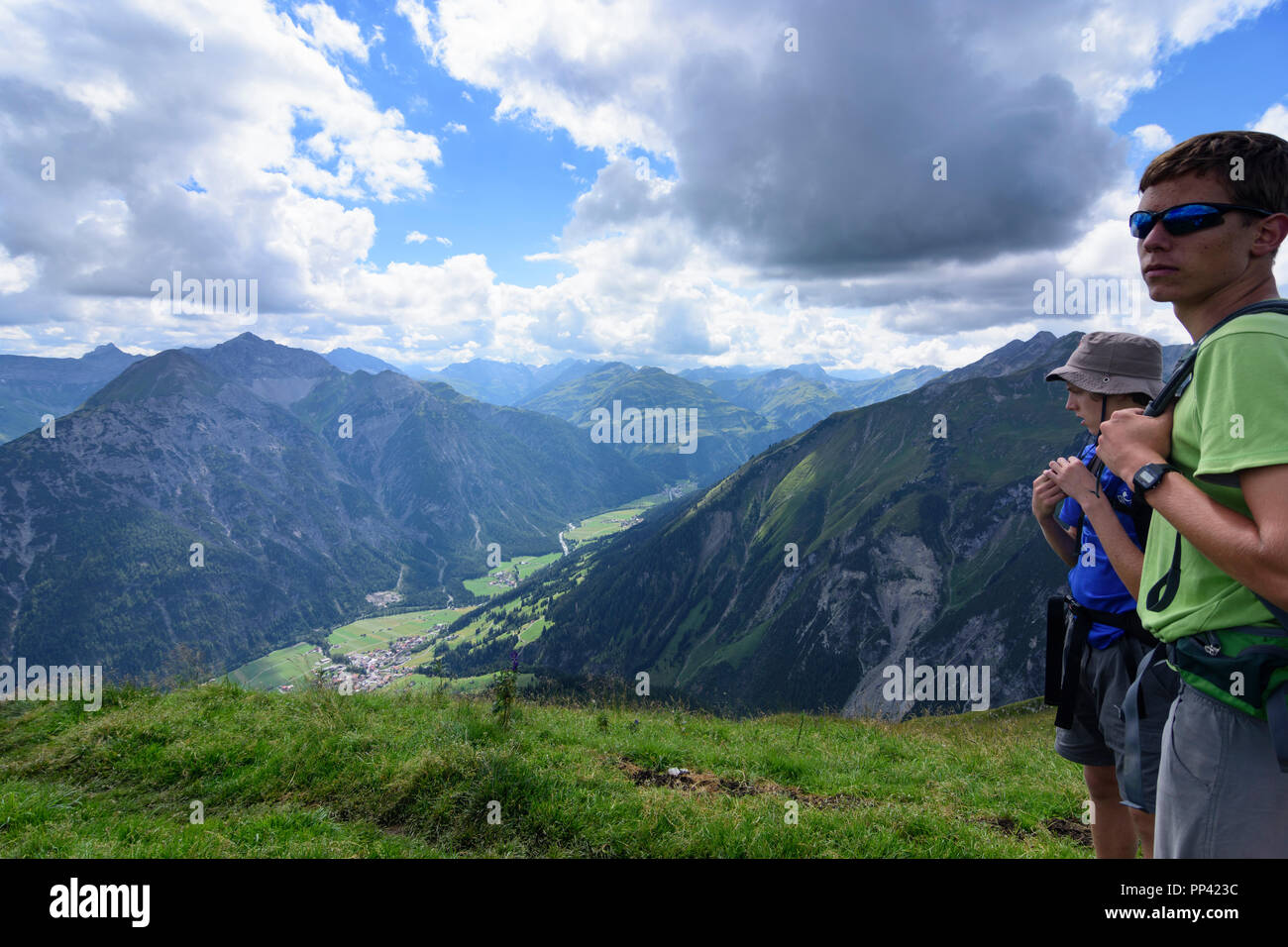 Holzgau: hiker, young man, boy above Lechtal (valley of river Lech) and ...