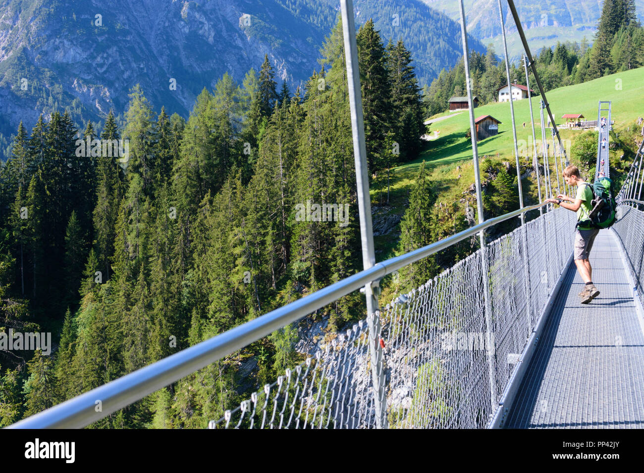 Holzgau: Hängebrücke (suspension bridge), hiker, Lechtal Valley, Tirol ...