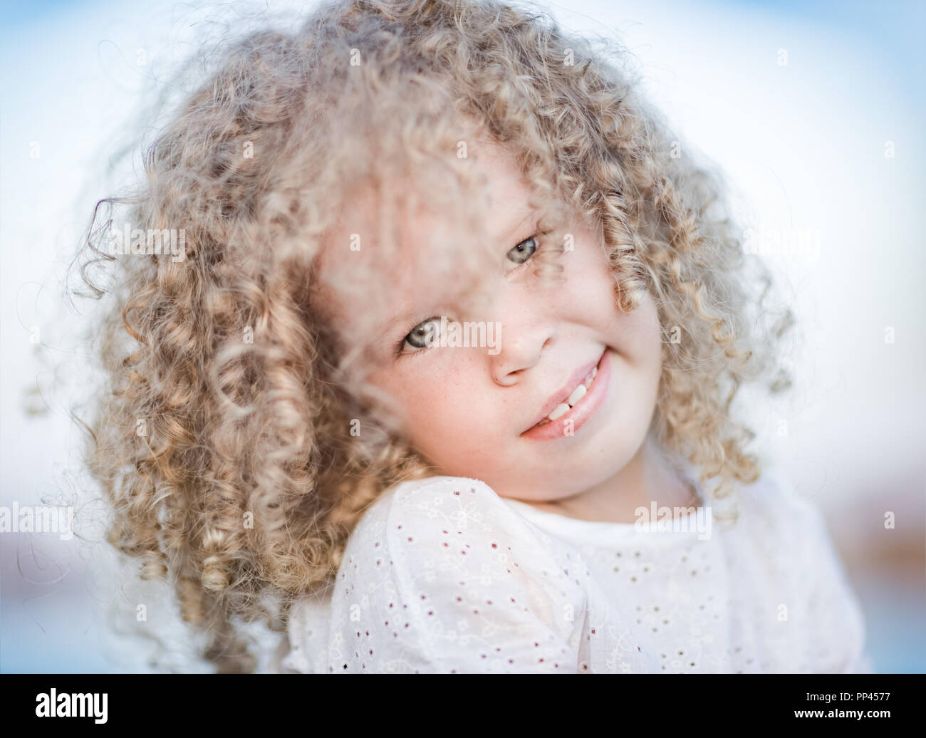 Outdoor portrait of a smiling little girl. Positive emotion concept ...