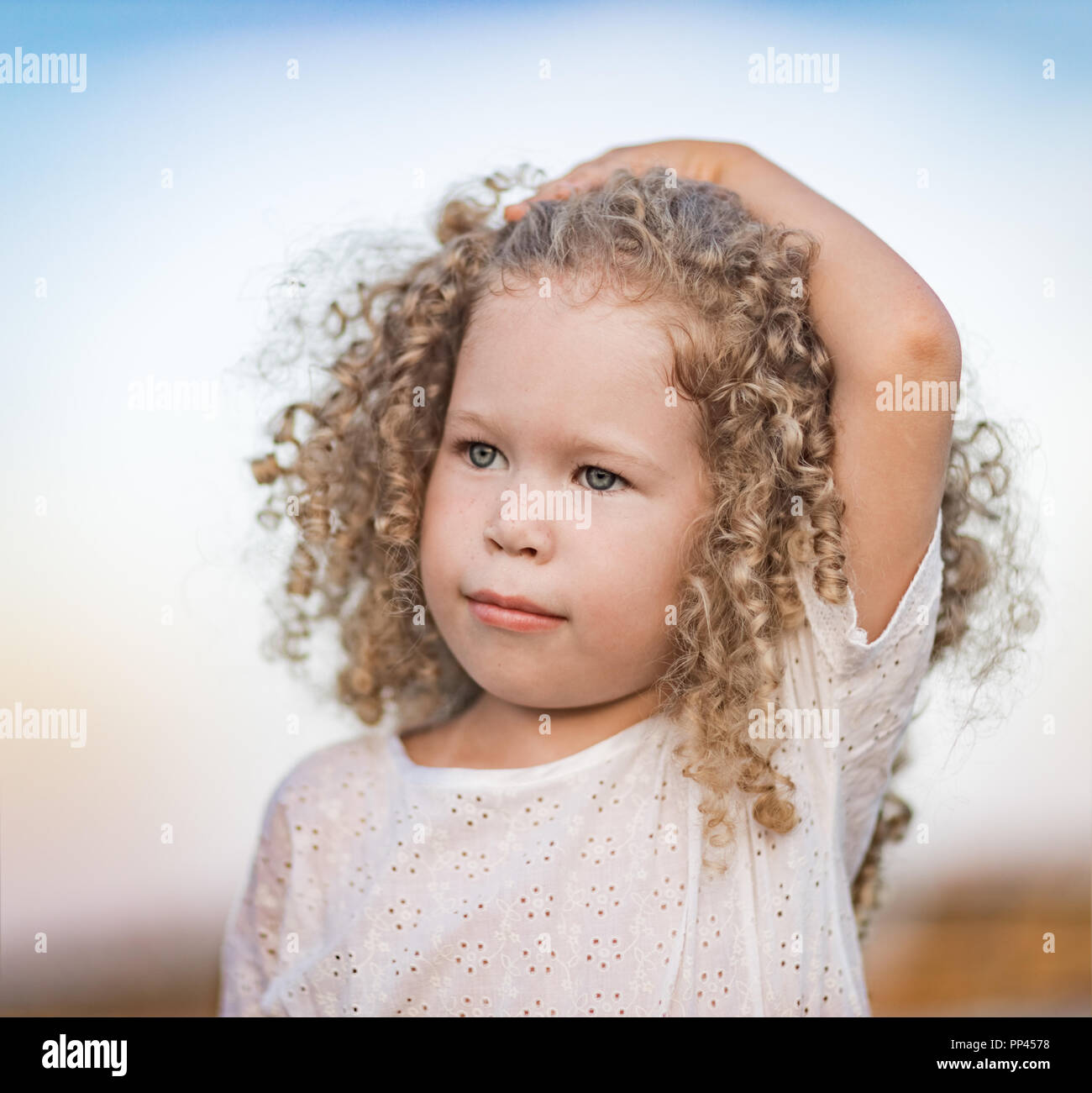 Outdoor portrait of a smiling little girl. Positive emotion concept ...