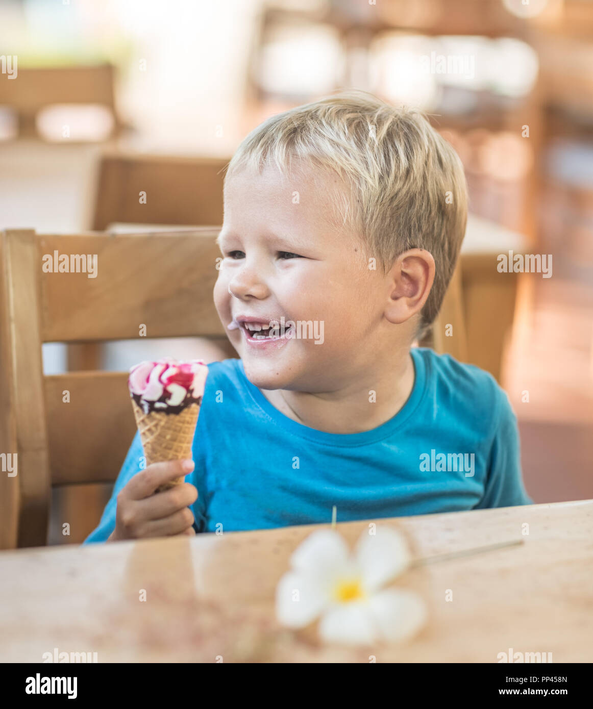 Cute boy eating ice cream Stock Photo - Alamy