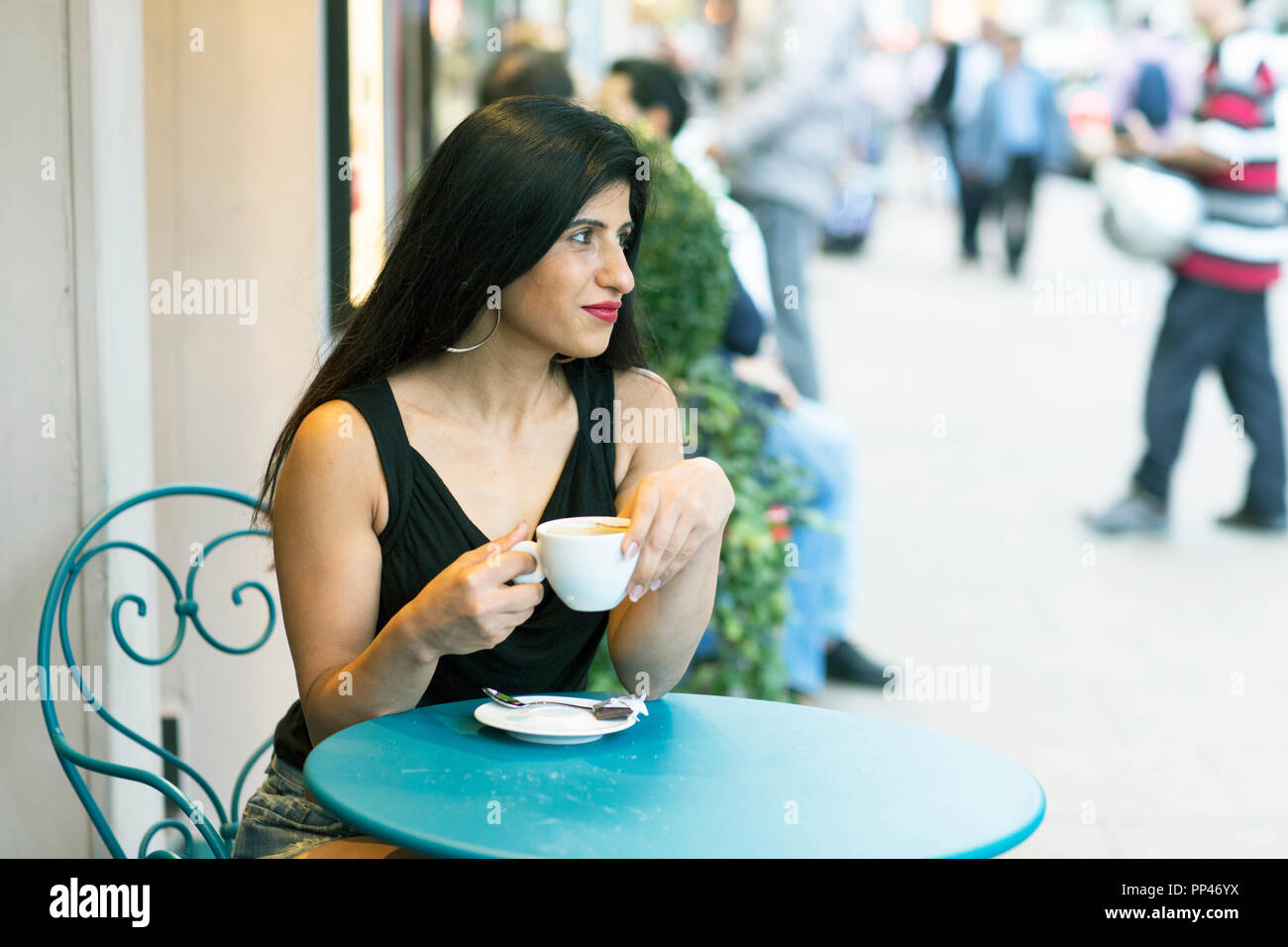 Indian girl enjoying coffee cafe hi-res stock photography and images ...