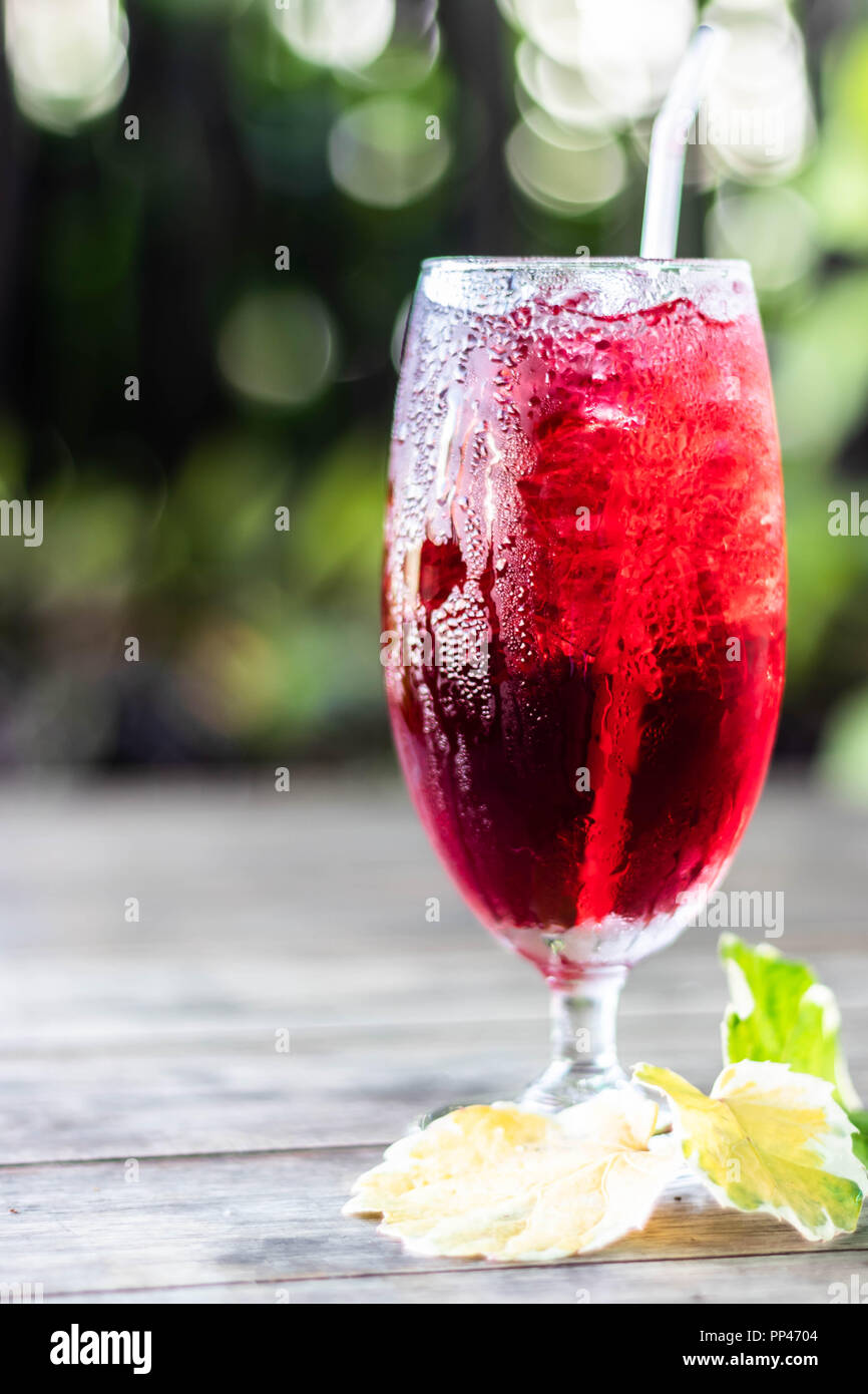Roselle juice on ice. Organic on brown wood floor for healthy Stock ...
