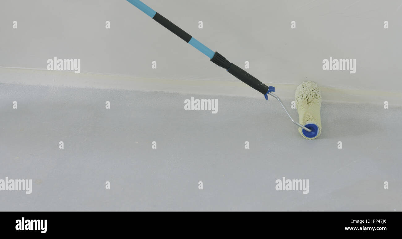 Applying liquid primer coating construction hi-res stock photography ...