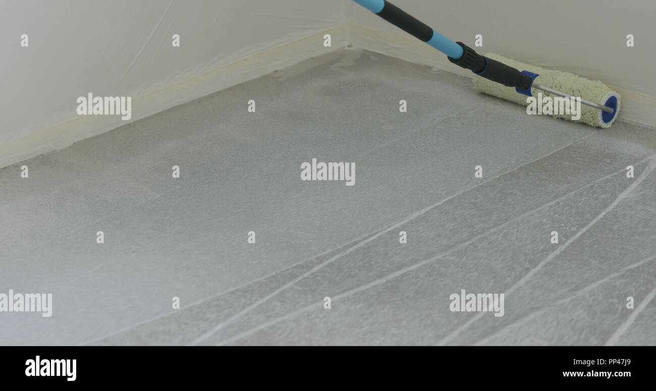 Applying liquid primer coating construction hi-res stock photography ...