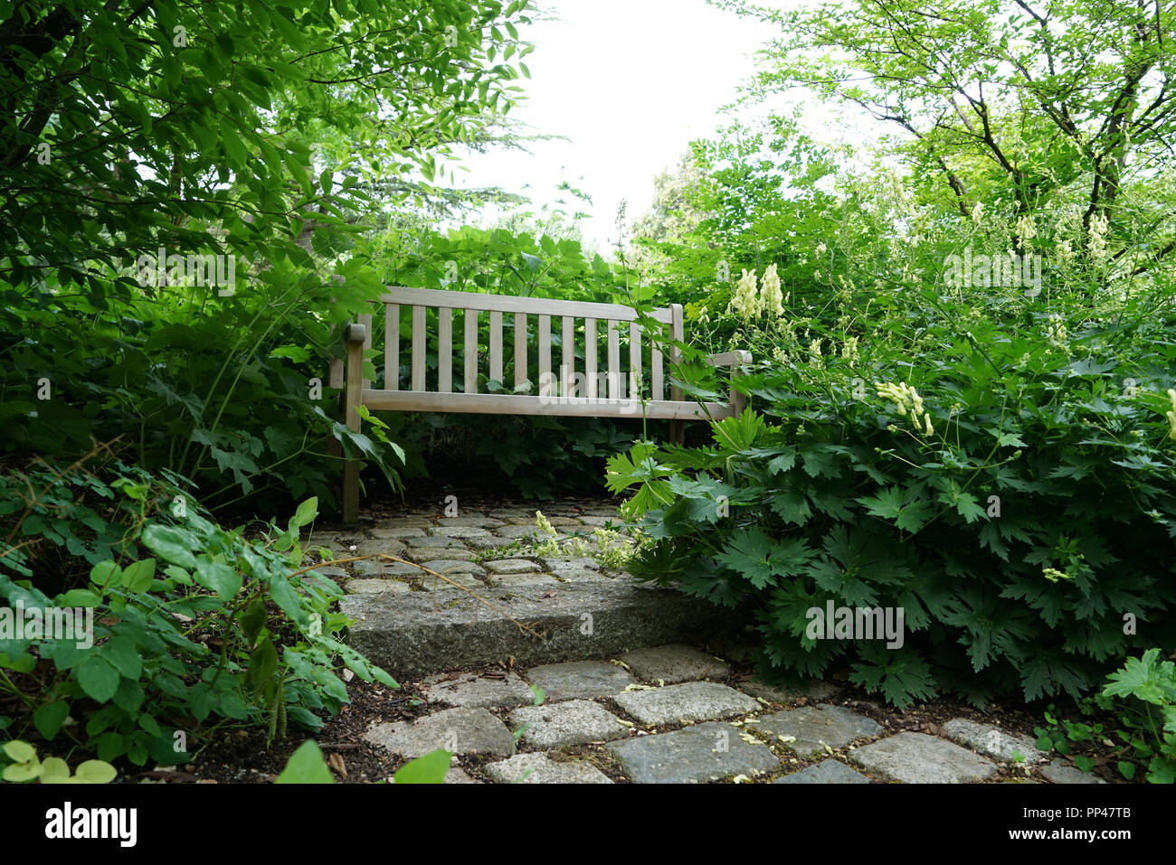 Park bench in a Bavarian park to relax and rest Stock Photo - Alamy