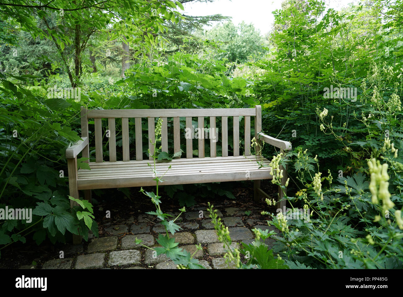 Park bench in a Bavarian park to relax and rest Stock Photo - Alamy