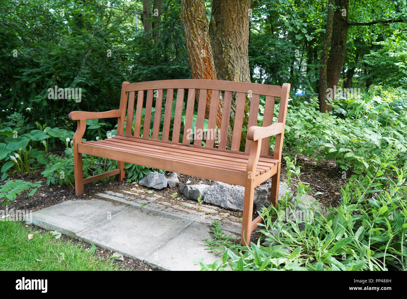 Park bench in a Bavarian park to relax and rest Stock Photo - Alamy