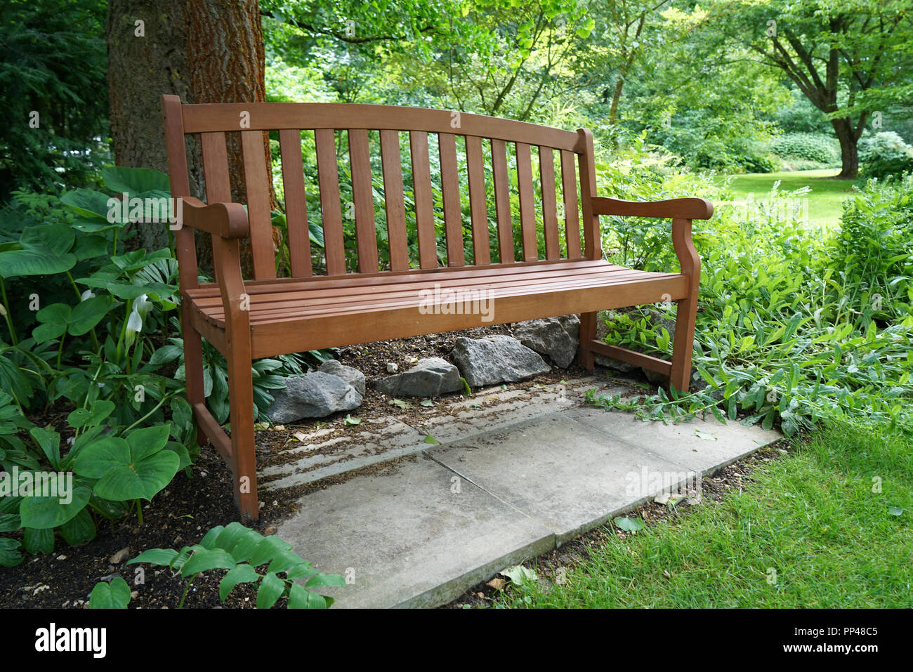 Park bench in a Bavarian park to relax and rest Stock Photo - Alamy