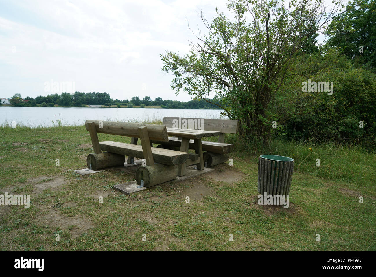 Park bench in a Bavarian park to relax and rest Stock Photo - Alamy